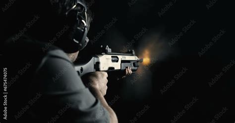 Back Of Person Shooting A Shotgun In High Speed Captured At 800 Fps