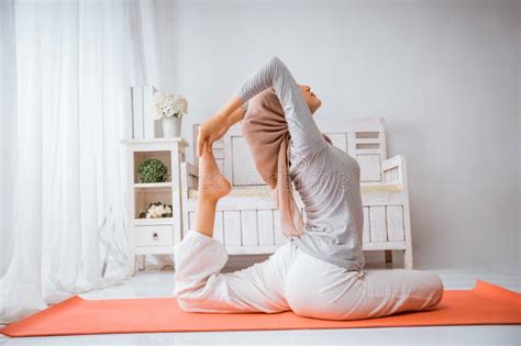 Muslim Woman Instructor Wearing Hijab Doing Yoga Pilates Pose On