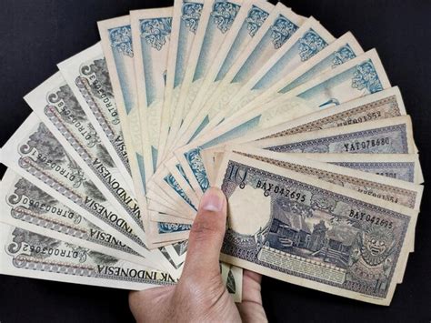 Premium Photo A Man Holds Old Indonesian Banknotes Money Old Currency