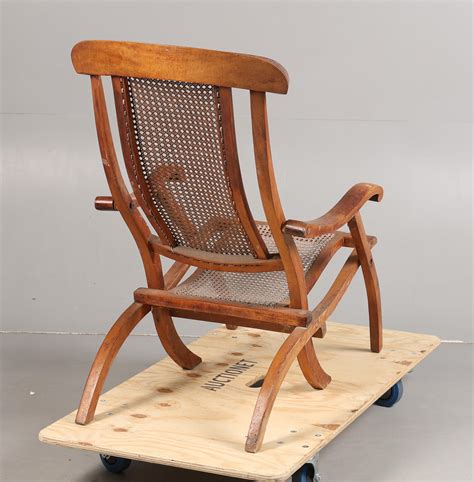 An Early 20th Century Cane Folding Armchair Furniture Armchairs