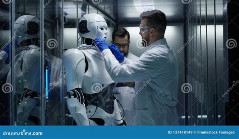 Engineers Testing On Robot Controls Inside The Laboratory Stock Image