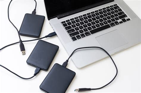 Premium Photo External Backup Disk Hard Drive Connected To Laptop High Quality Photo