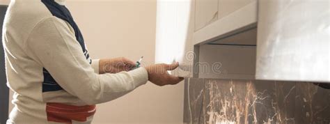 Worker Assembling Of New Kitchen Furniture Stock Image Image Of