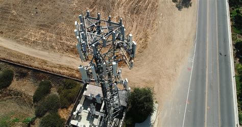 Aerial Of Cellular Wireless Mobile Data Tower With Neighborhood