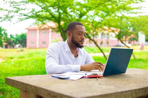 Premium Photo African Student Copying His Assignment From The Internet