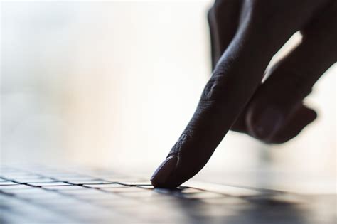 Premium Photo Female Finger Presses A Button On A Laptop Keyboard Business And Technology Premium Photo Female Finger Presses A Button On A Laptop Keyboard Business And Technology