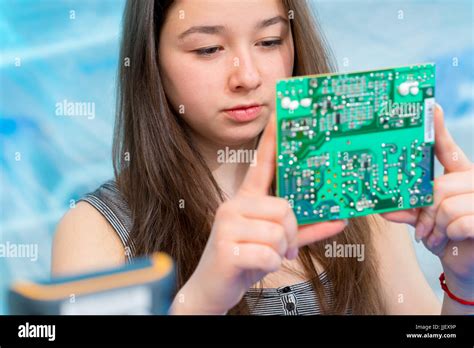 Student Girl In Electronics Laboratory Experiment With Microcontroller