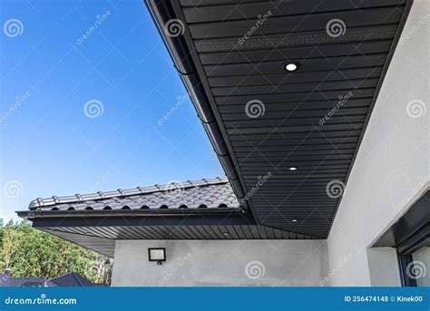 A Modern Graphite Herringbone Roof Lining Is Attached To The Trusses
