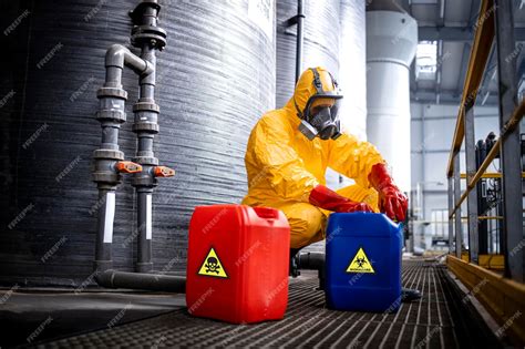 Premium Photo Factory Worker In Hazmat Protective Suit And Gas Mask
