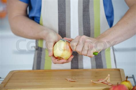 Man Peeling An Apple Cut Out Stock Image Colourbox