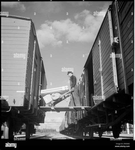 Loading Between Freight Wagons Stock Photo Alamy