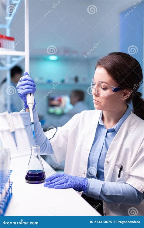 Scientist Looking Into Micropipette For Biology Test Stock Image Image Of Woman Technology