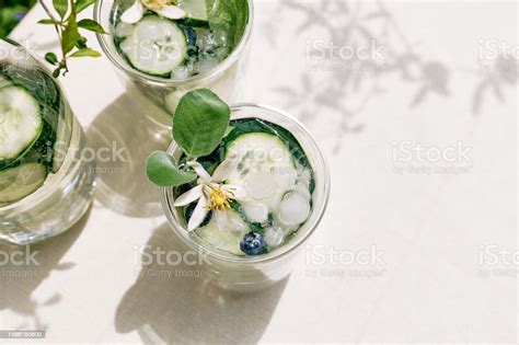 Refreshing Summer Drink Cucumber Infused Water With Ice Sage Cucumber And Lemon Blossom On The