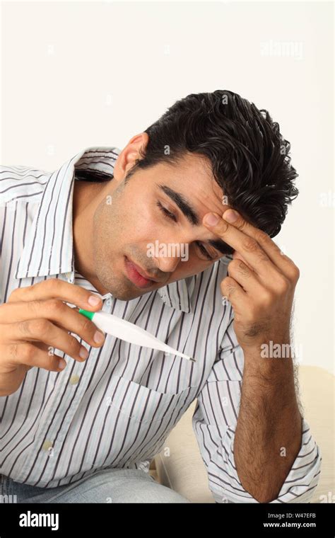 Man Checking His Temperature Stock Photo Alamy