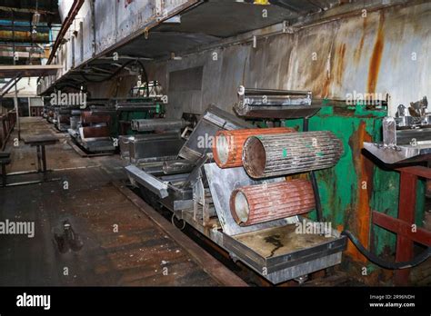 Large Metal Rollers Rolls With Teeth Of The Gears Of The Production Line A Conveyor Belt In The