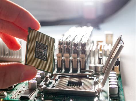 The Process Of Connecting The CPU To The Processor Socket On A Modern Computer Motherboard