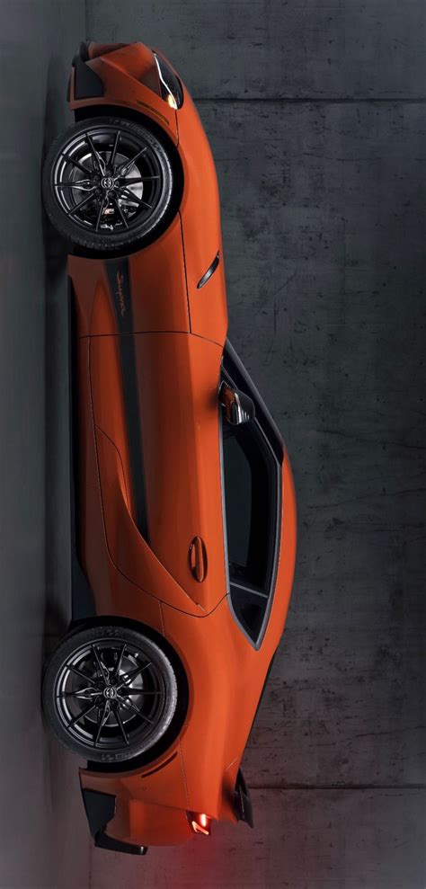 An Orange Sports Car Is Shown From Above