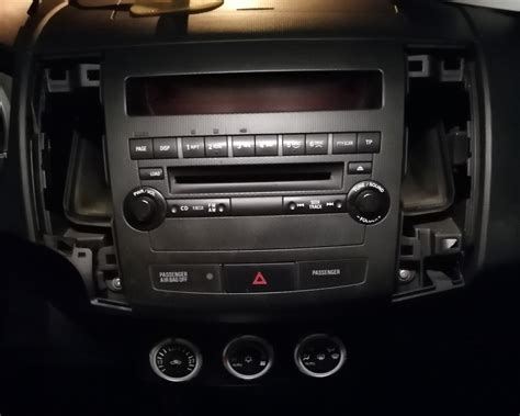 Где находится усилитель в автомагнитоле на митсубиси аутлендер хл 95 фото