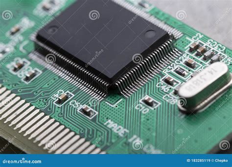 Computer Processor Chip On A Circuit Board With Microchips And Other Electronic Parts CPU Chip