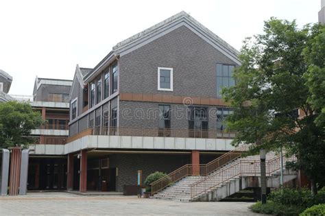 A Three Story School Building With Two Large Rooms On The First Floor