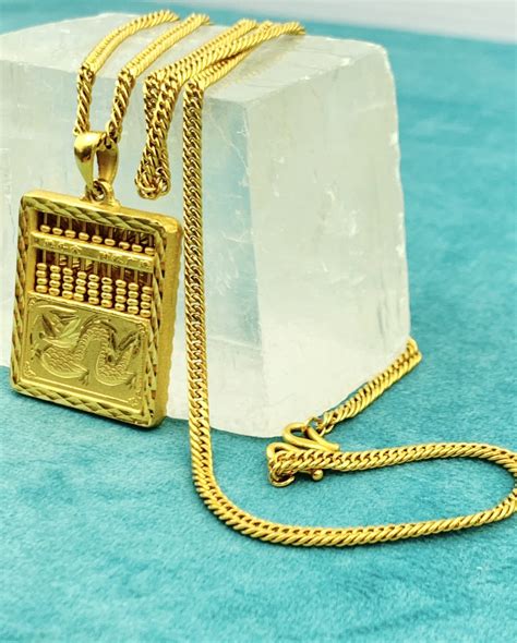 24ct gold chain and abacus pendant kingsestate