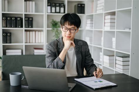 Young Business Man Executive Manager Looking At Laptop Watching Online Webinar Training Or