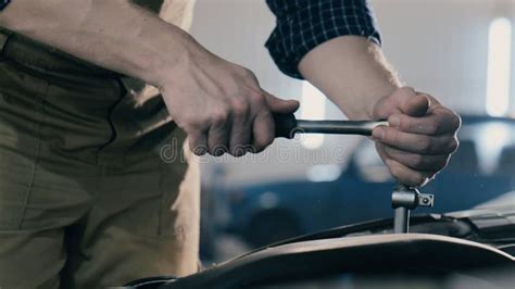 Hands of an Auto Mechanic Close-up Working on a Car Engine in a Car ...