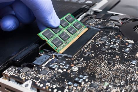 Premium Photo Service Engineer Install New Ram Memory Chips To The Laptop