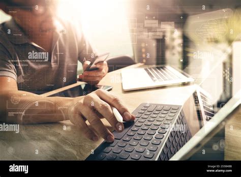 outsource developer working on marble desk working laptop computer