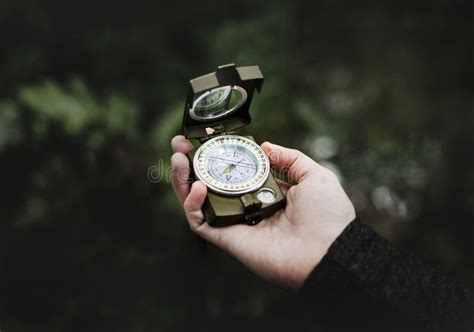 Person Trekking In A Forest Using Compass Stock Image Image Of Jungle
