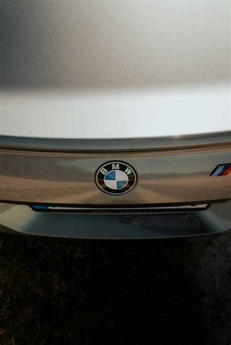 The Bmw Emblem Is Visible On The Car Photo Free Car Image On Unsplash