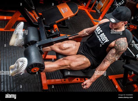Male Bodybuilder Doing Leg Curl In The Gym Stock Photo Alamy