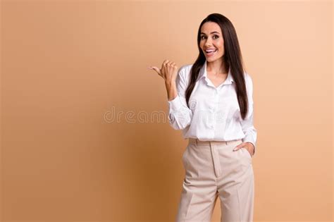 Photo Of Astonished Pretty Agent Girl Direct Finger Empty Space