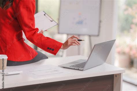 Female Attractive Asian Banker Accountant Wearing Red Formal Suit Calculate The Cash Bill Of