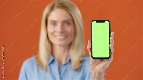 Blur Background Of Woman Showing Mobile With Mock Up Screen Stock Video