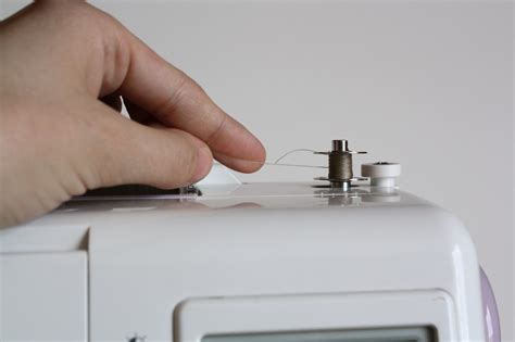 Threading The Sewing Machine Bobbin Yellow Spool