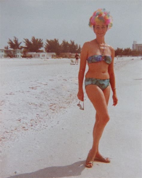 If You Got It Flaunt It Sexy Older Woman Poses On The Beach In Bikini