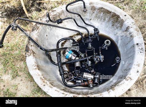 A Fuel Pump Has All Connector Elements Separated From The Tractor Engine For Repair Stock Photo