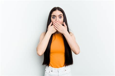 Premium Photo Covering Mouth With Hands Looking Worried
