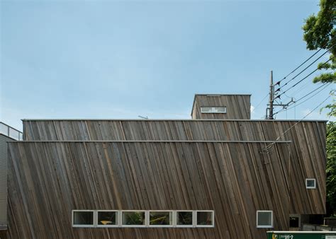 Kyodo House By Sandwich Has Wood Facade And Indoor Swing