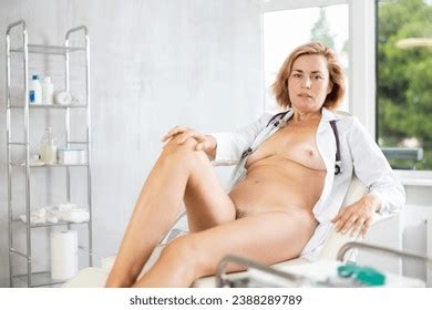 Smiling Nude Doctor Laying On Exam Stock Photo Shutterstock