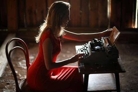 Premium Photo A Girl In Retro Style Prints On An Old Typewriter