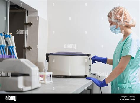 Lady Prepearing For Medical Research With Centrifuge In Hospital Stock Photo Alamy