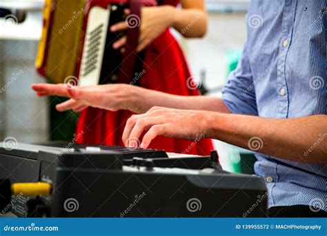 A Woman Playing An Accordion And A Man Playing The Keyboard Stock Photo Image Of Pianist