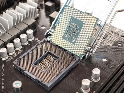 The Process Of Connecting The Cpu To The Processor Socket On A Modern Computer Motherboard
