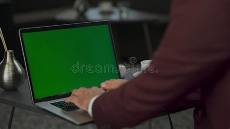 unrecognized freelancer using green screen laptop office hands working