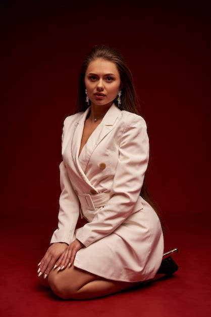 Premium Photo Beautiful Brunette Girl In A Long White Jacket Posing