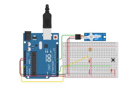 circuit design servo control w push button and ldr tinkercad