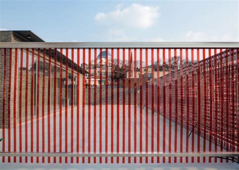 Red Mirrored Lattice Encloses Office Block By Wise Architecture
