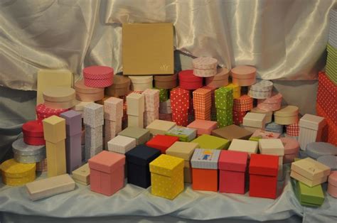 There Are Many Different Boxes On The Table And One Is Made Out Of Cardboards